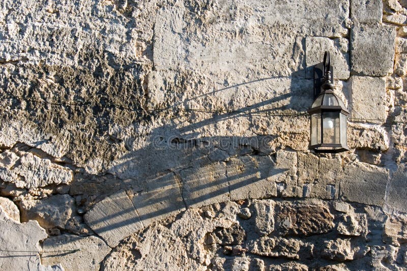 Lamp on a Rustic Wall with Shadow Stock Photo - Image of bulb, building ...