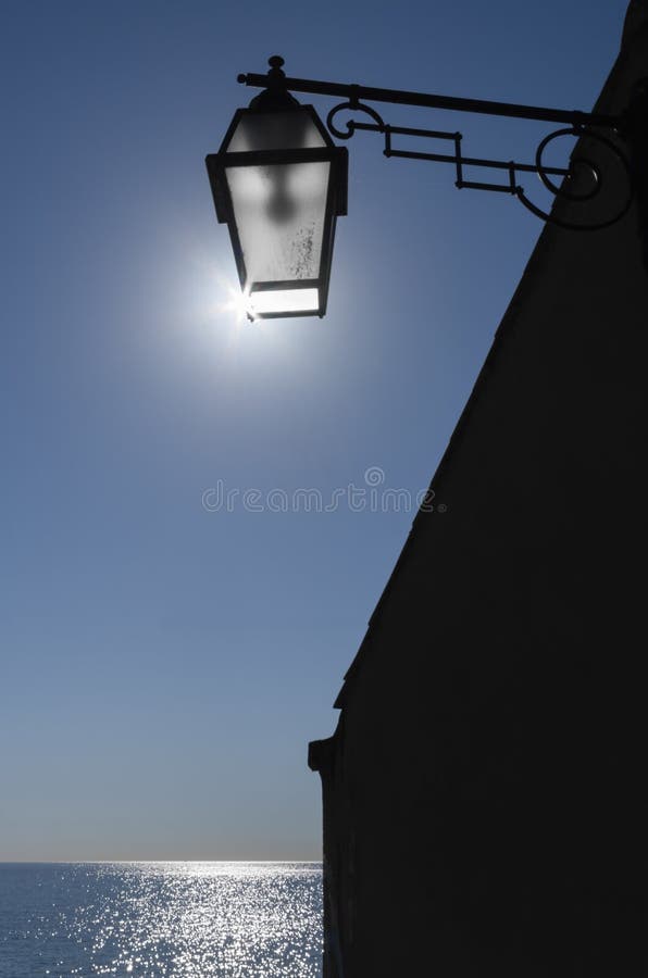 The Lamp on the Sea Lights Up with the Light of the Sun Stock Image ...