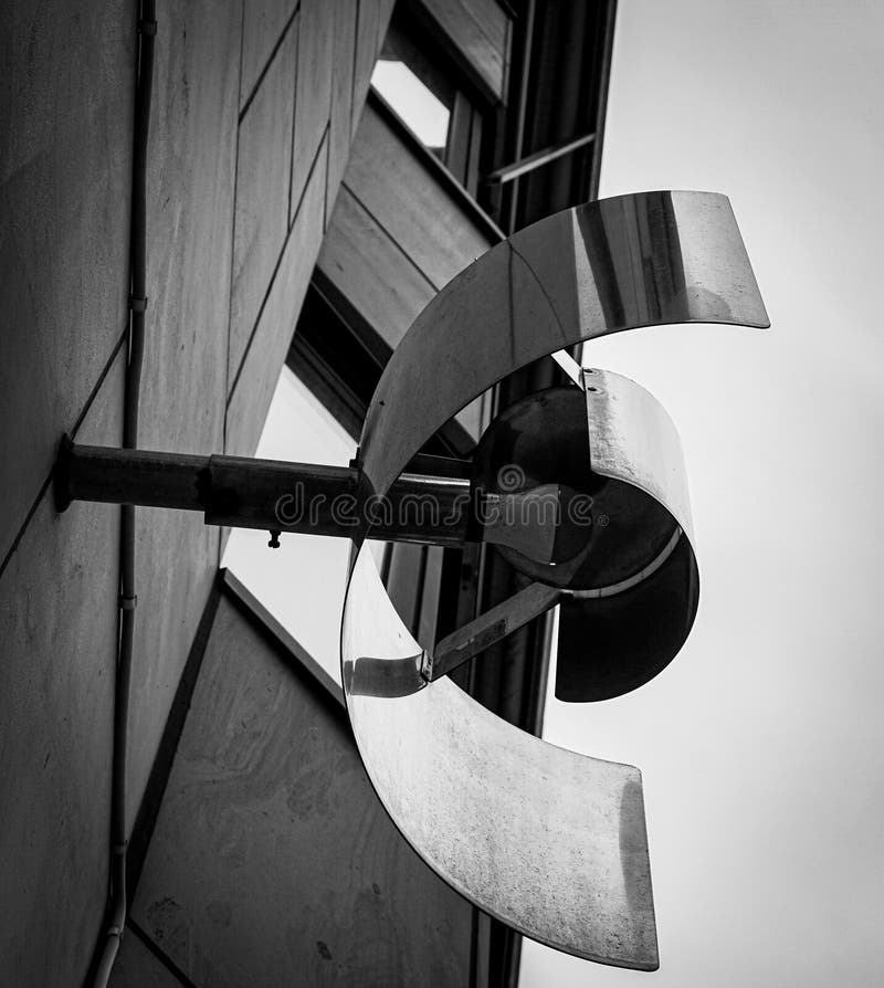 A Lamp on the Side of a Building Stock Photo - Image of monochrome ...
