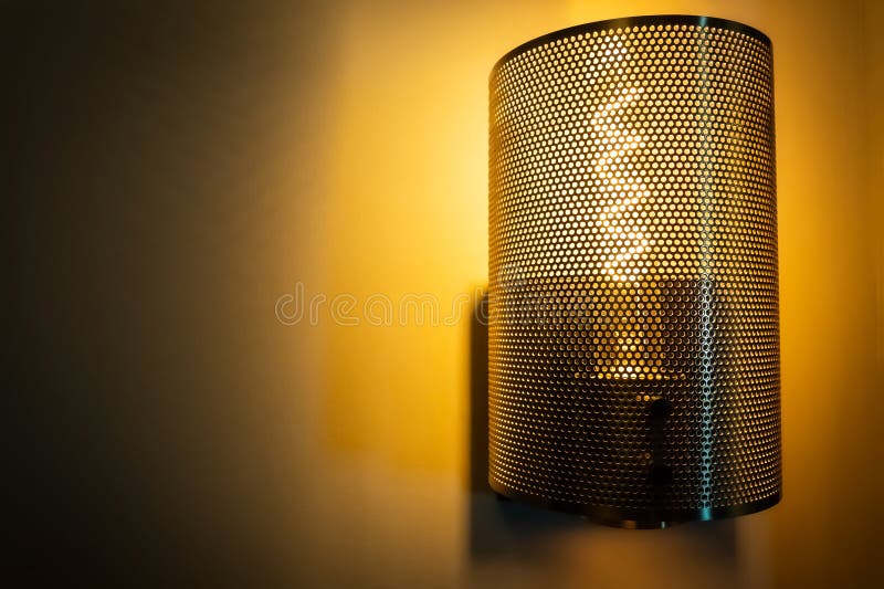 Lamp on the Wall with Metal Grid Protection and Incandescent Bulb Stock ...