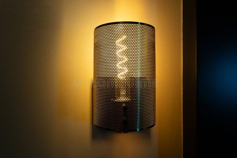 Lamp on the Wall with Metal Grid Protection and Incandescent Bulb Stock ...