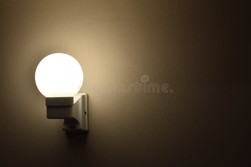A Lamp on the Wall is Showing Dim Light . Stock Photo - Image of ...