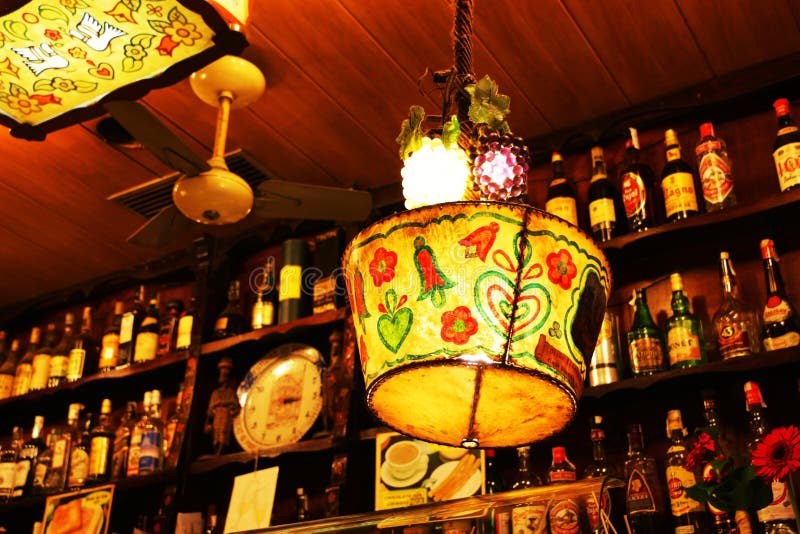 Lamp and Winebottles in a Cookshop Editorial Photography - Image of ...