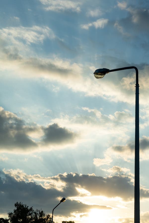 Lamppost on the Background of the Evening Sky with the Rays of the ...