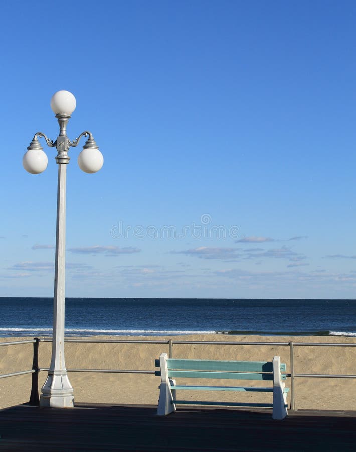 Lamppost and bench stock photo. Image of light, beach - 62316914