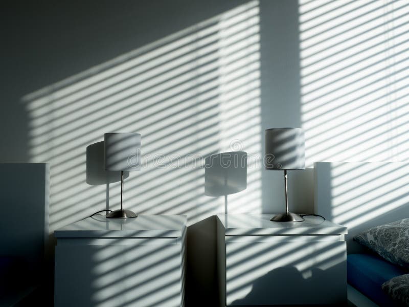 Lamps in Shadow in a Hotel Room with Falling Light Stock Image - Image ...