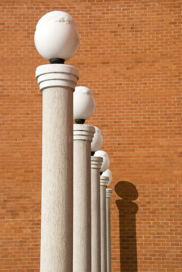 Lamps on white columns stock photo. Image of architecture - 18496738