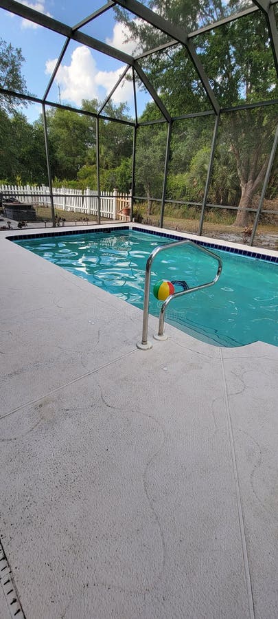 The Lanai with a Pool and Full Screen Enclosure Go Swimming Stock Image ...