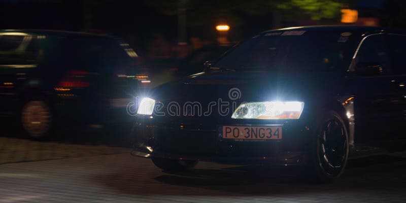 Lancer Evolution VIII Wagon in the Dark with Headlights on Editorial ...
