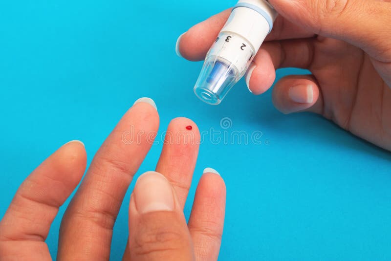 The Lancet Device Pierces the Finger Closeup Stock Photo - Image of ...
