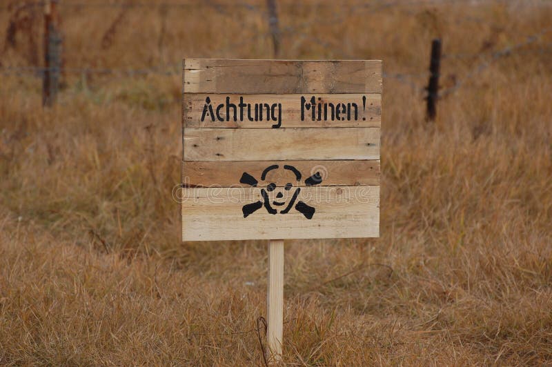 Land mine warning sign stock photo. Image of security - 21940024