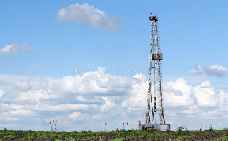 Land Oil Drilling Rig on Field Stock Photo - Image of large, cloud ...