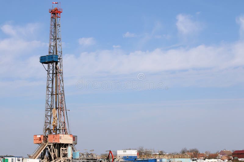 Land Oil Drilling Rig on Field Stock Photo - Image of large, cloud ...
