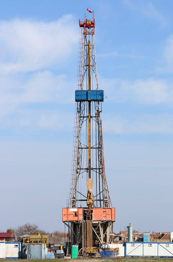 Land Oil Drilling Rig on Field Stock Photo - Image of large, cloud ...
