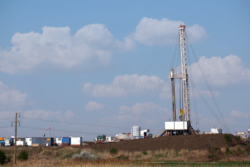 Land Oil Drilling Rig on Field Stock Photo - Image of large, cloud ...
