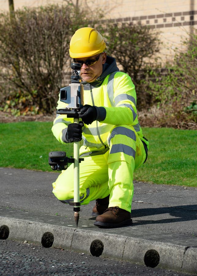Land Surveyor Performing Initial Survey of the Road Levels and Kerb ...