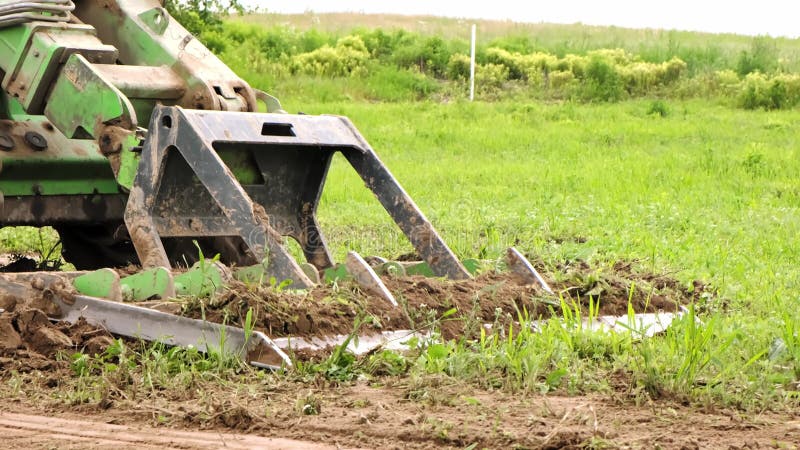 Land Work by the Territory Improvement. Small Tractor with a Ground ...