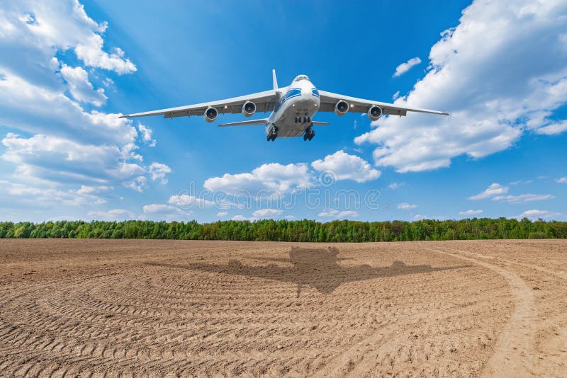 Landing of the Big Cargo Airliner. Stock Photo - Image of meadow ...