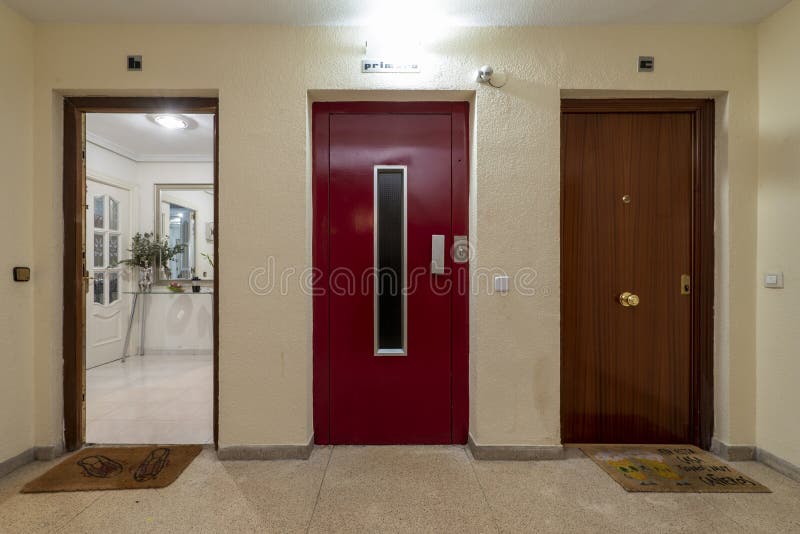 Landing of a House with an Elevator with a Red Door Stock Image - Image ...
