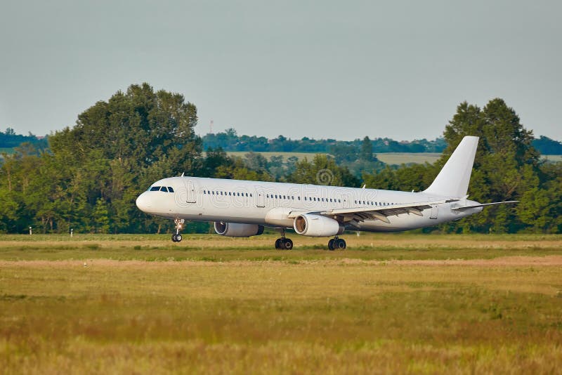 Plane landing on runway stock photo. Image of aircraft - 142934858