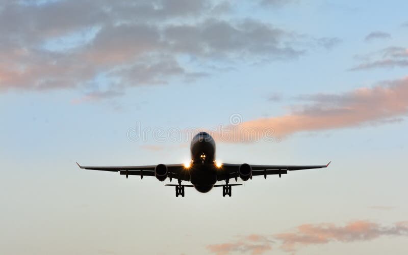 Landing plane. Front view stock image. Image of business - 62424207