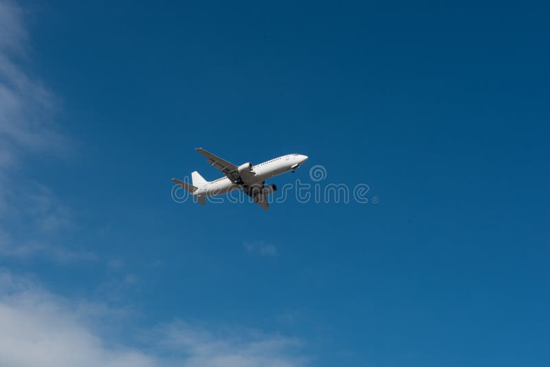 Landing Plane in Good Weather Against a Blue Sky Stock Image - Image of ...