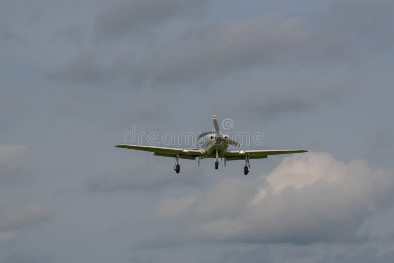 A Landing Plane on a Gray Background Stock Photo - Image of oldies ...