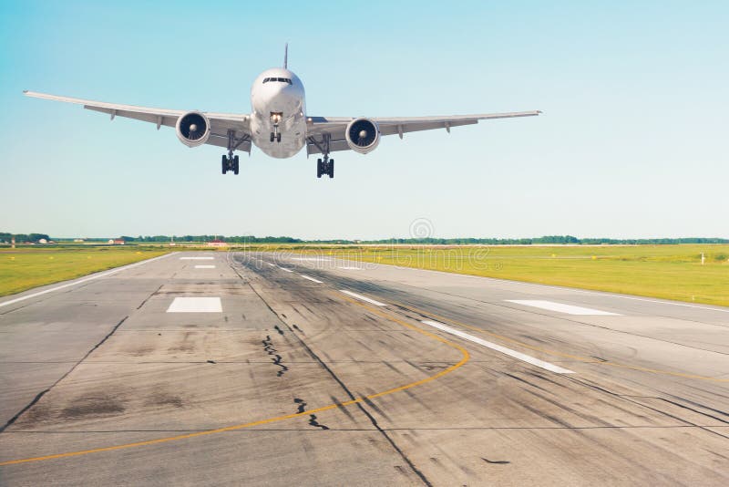 Landing Plane on the Runway in Strong Winds at the Airport Stock Image ...