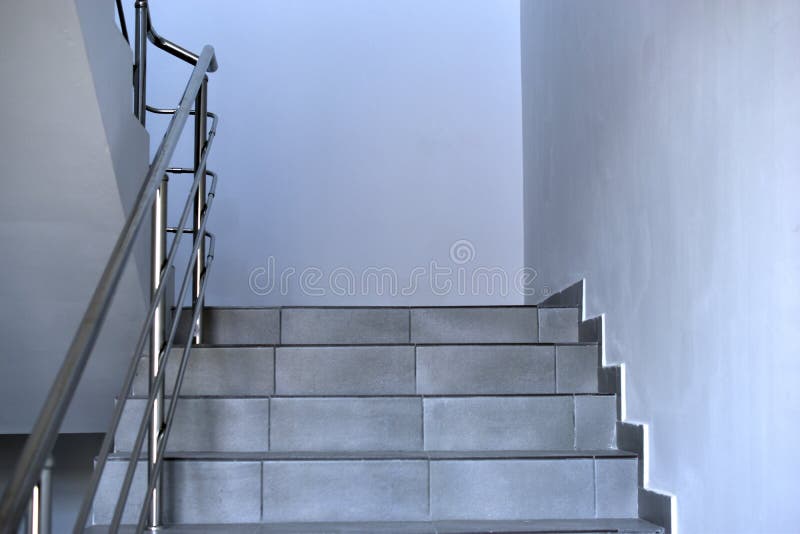 A Landing with a Staircase and a Shiny Railing Stock Photo - Image of ...
