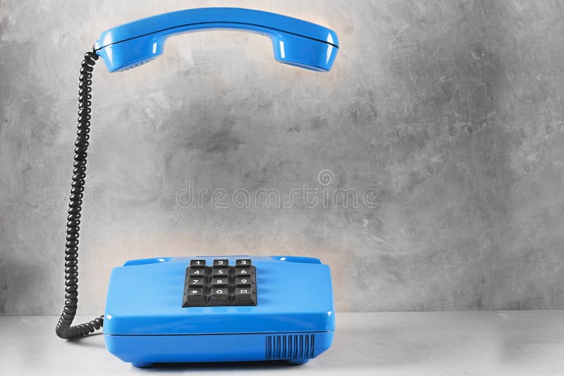 Landline Blue Phone on Gray Wall Background Stock Photo - Image of ...