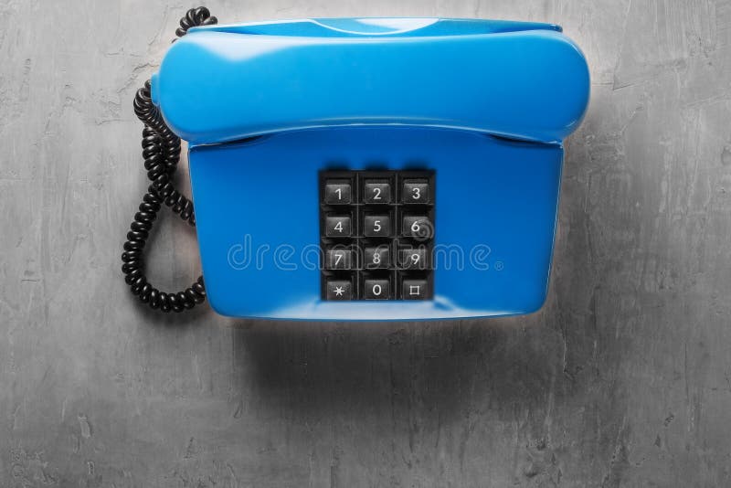 Landline Blue Phone on a Gray Wall Background Stock Image - Image of ...