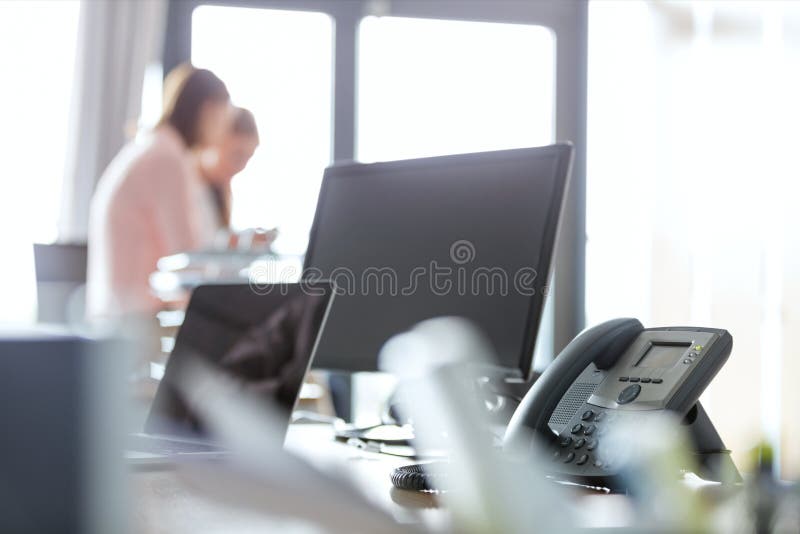 Landline Phone with Laptop and Computer on Office Desk Stock Image ...