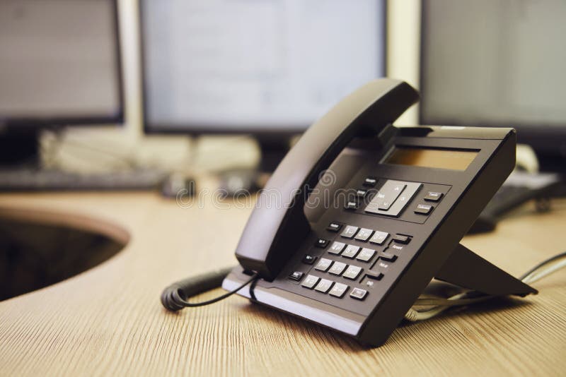 Landline Phone on Office Desk with Computer Monitors and Keyboards ...