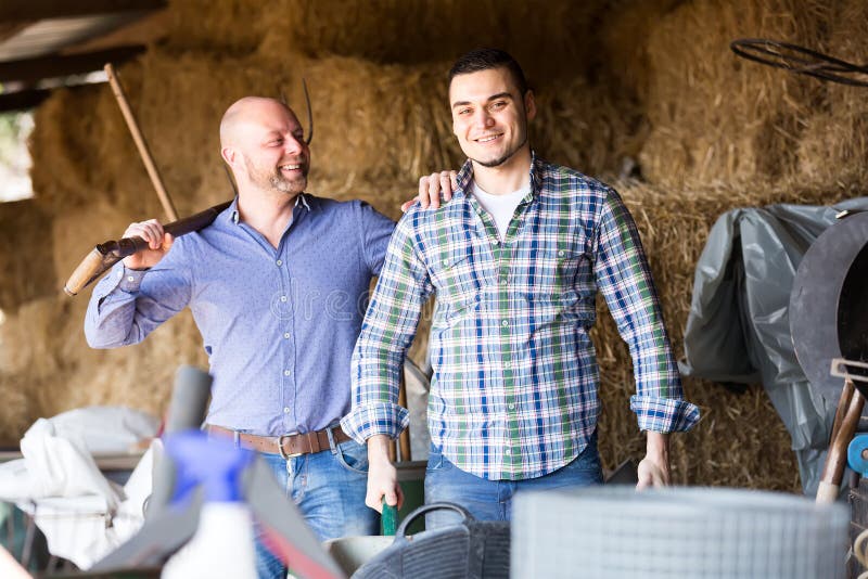 Landlords Working in a Barn Stock Photo - Image of lifestyle, break ...