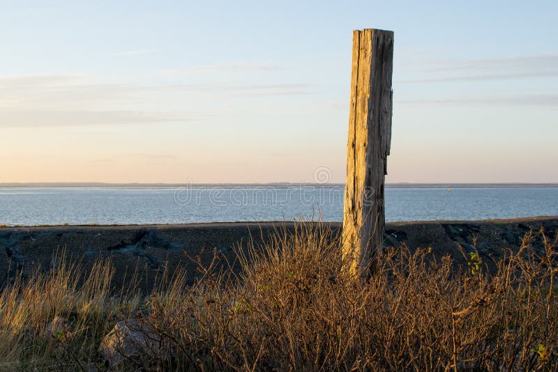 Landmark Pole on the Seaside in the Sunset. Stock Photo - Image of ...