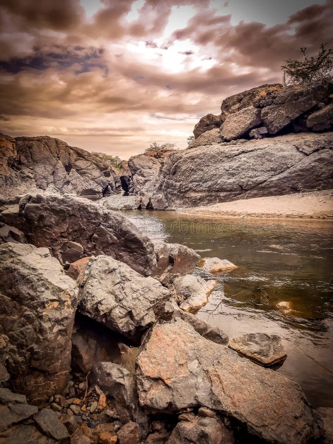 Landscape Background of River Flowing through Rock Formations Stock ...