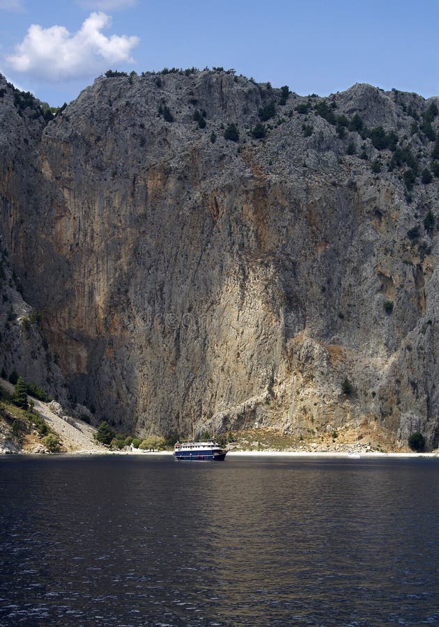 Landscape - Big Rock and Small Boat Stock Photo - Image of rock, aegean ...
