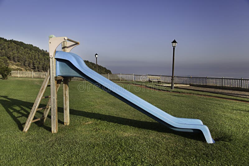 Blue slide in the park stock photo. Image of childhood - 32845936