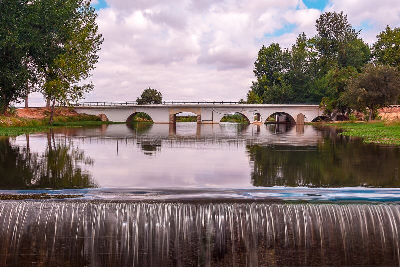 Landscape of a Bridge Over a River Under a Beautiful Sky Stock Image ...