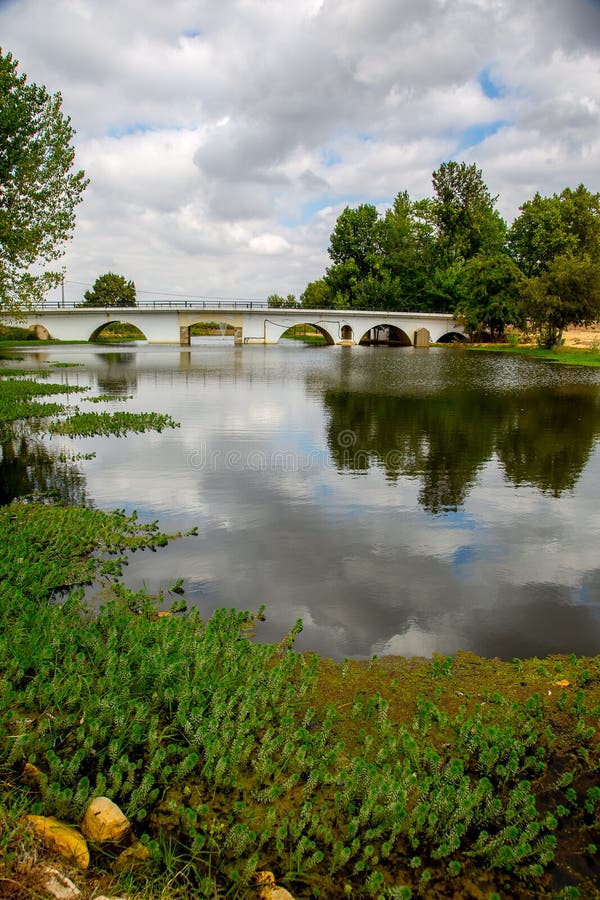 Landscape of a Bridge Over a River Under a Beautiful Sky Stock Photo ...