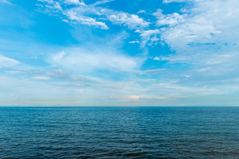 Calm ocean with clouds sky stock photo. Image of seascape - 136696028