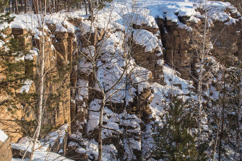 Landscape with Cliffs Covered with Trees in the Snow Stock Photo ...