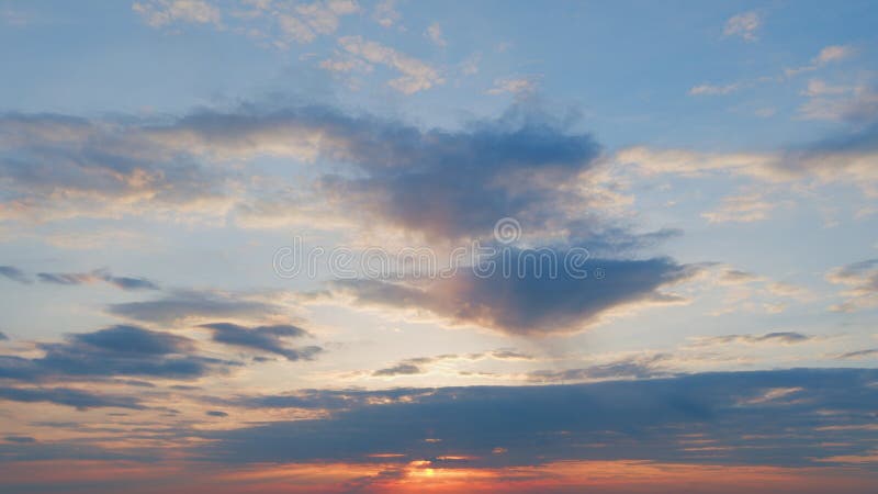 Landscape of Clouds Moving Across the Sky Against the Setting Sun ...