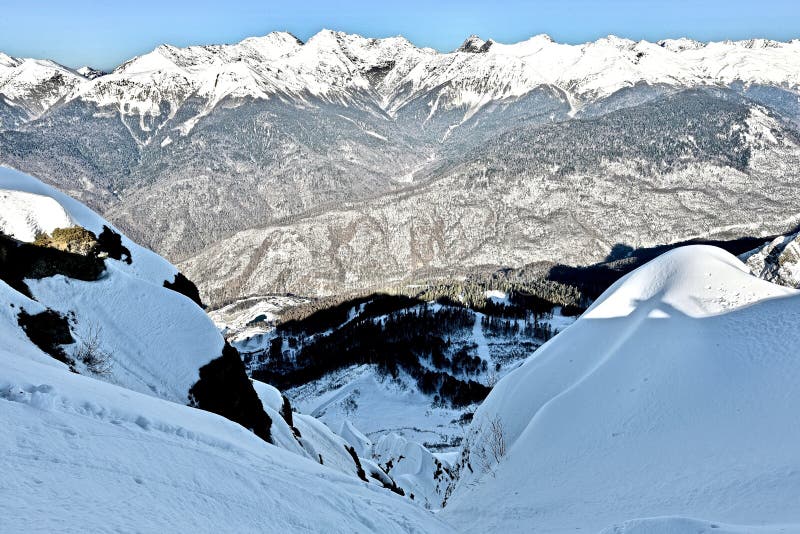Landscape of Deep Gorges and High Mountains with Snow-capped Peaks ...