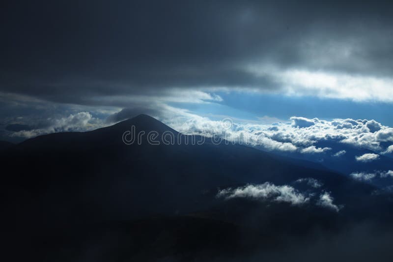 Landscape of Dramatic Clouds and Nebula on Mountain Peaks. between Sky ...