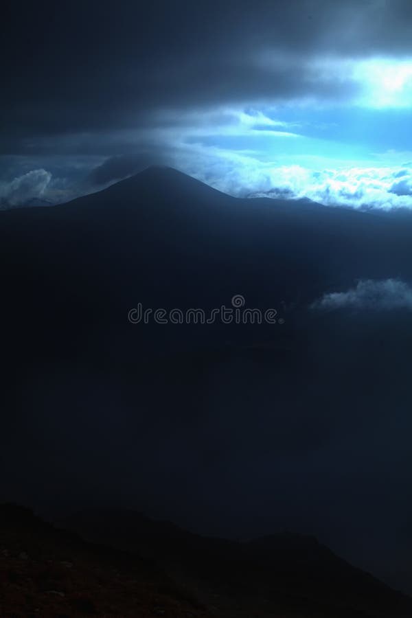 Landscape of Dramatic Clouds and Nebula on Mountain Peaks. between Sky ...