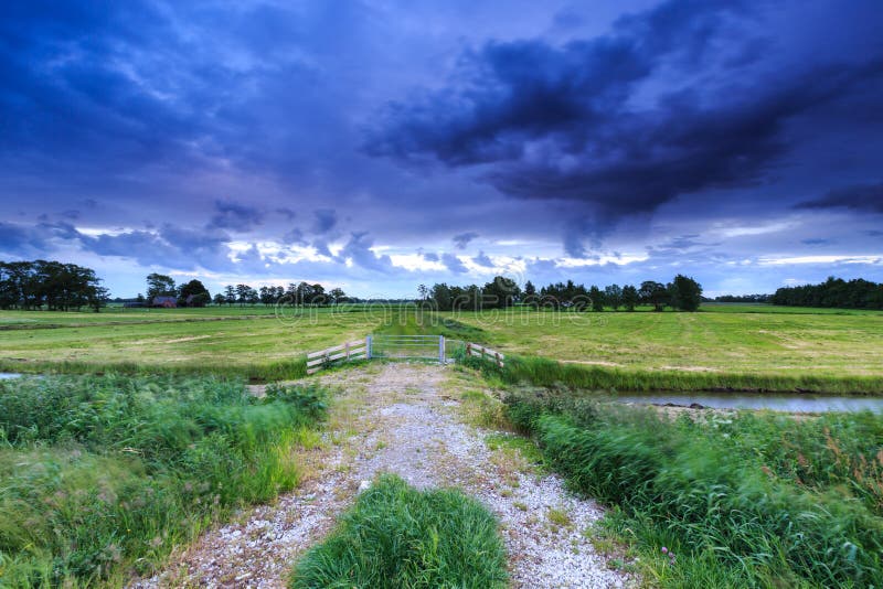 Landscape with Farmland and Dark Clouds Stock Photo - Image of scenery ...