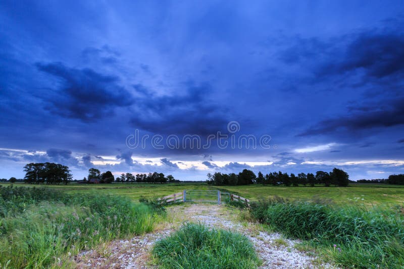 Landscape with Farmland and Dark Clouds Stock Image - Image of view ...