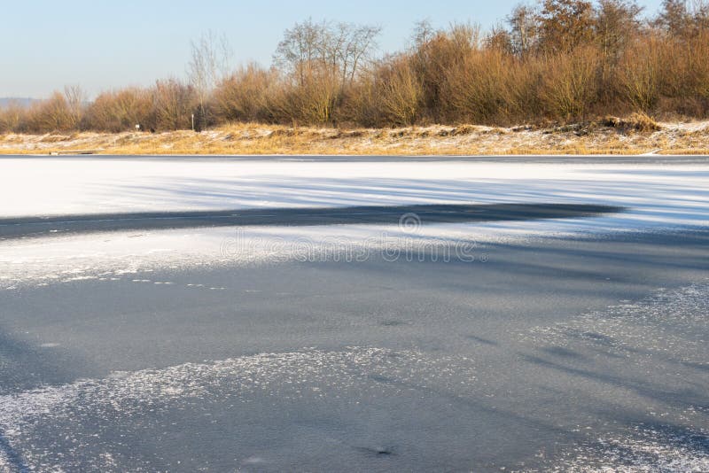 Landscape of a Frozen Lake Covered with Snow Stock Image - Image of ...