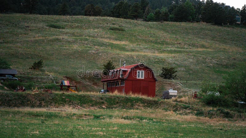 Landscape of an Old Barn Surrounded by Hills and Greenery Covered in ...